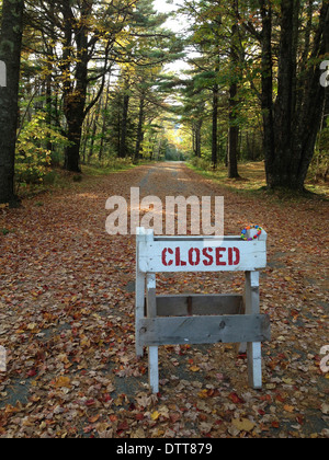 Closed woodland path with a sign on the meadow Stock Photo - Alamy