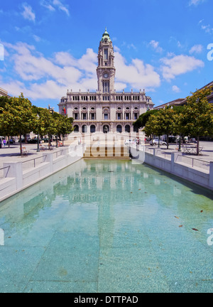 View of Porto Town Hall reflecting in Fonte dos Aliados in Praca do ...