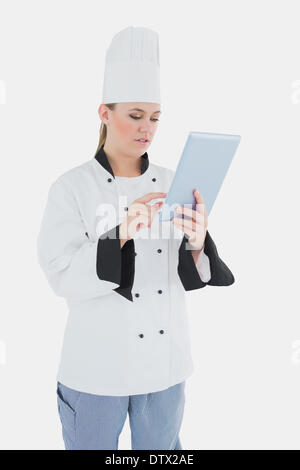 Chef using tablet pc Stock Photo - Alamy