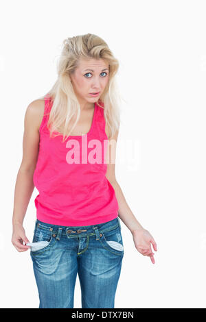 Woman with empty pockets Stock Photo - Alamy