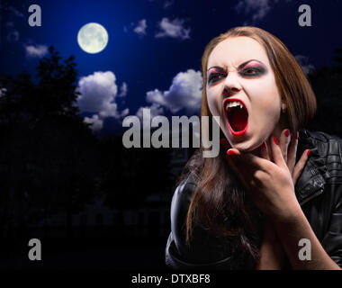 Vampire woman on night background with moon Stock Photo - Alamy