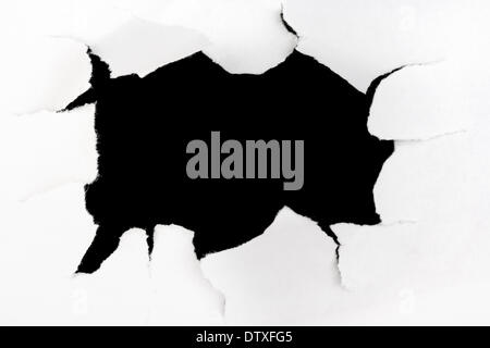 ragged hole in textured paper on white background Stock Photo - Alamy