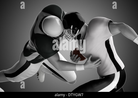 Side view of two American football helmets facing each other on a ...