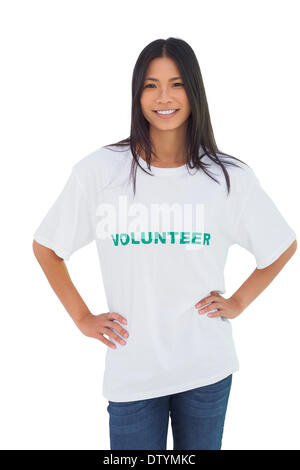 Young hispanic woman wearing volunteer uniform talking on the ...