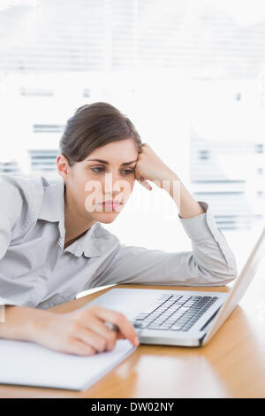 Exhausted businesswoman, fed up with all the work she has to do Stock ...