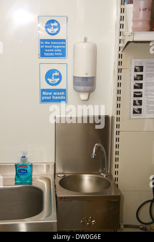 Hand wash soap dispenser and signs in food prep area Stock Photo - Alamy