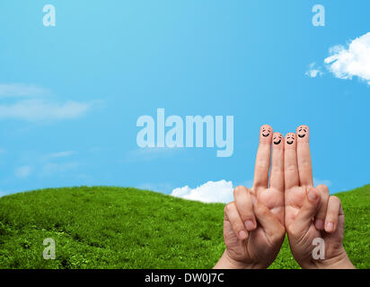 Cheerful finger smileys with landscape scenery at the background Stock ...