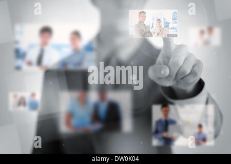 Businessman choosing a picture Stock Photo - Alamy