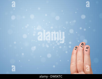 Happy finger smileys with empty blue bokeh background Stock Photo - Alamy