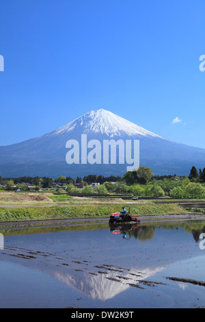 Fuji and a field and a tractor Stock Photo - Alamy