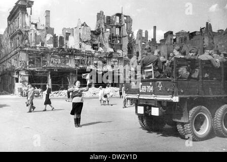 A Soviet traffic cop regulates the flow of traffic in Berlin, Germany ...
