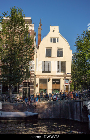 Canal and leaning building in Amsterdam, Netherlands Stock Photo - Alamy