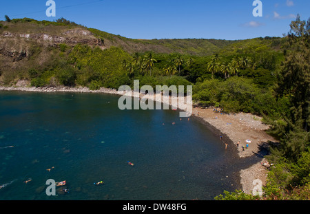 Aerial view of relaxing bay with two catamarans and snorklers swimming ...