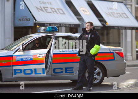 Armed City of London Police convoy escorts a prison van as it arrives ...