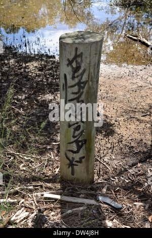 Graffiti on a log Stock Photo - Alamy