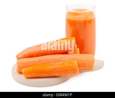 glass of carrot juice and fresh carrots on wooden table on green ...