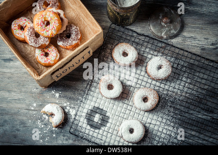 Tasting freshly baked donuts Stock Photo - Alamy