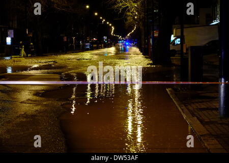 London, UK. 27th Feb, 2014. Burst water main floods the A3 Clapham Rd ...