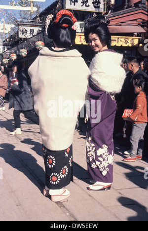 two pretty geisha girls friends: modern asian woman and traditional ...