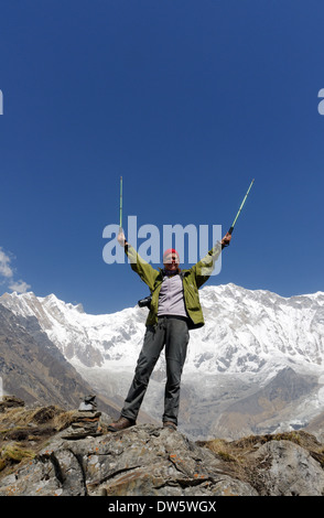 A lady trekker celebrates arriving at Annapurna Base Camp in the ...