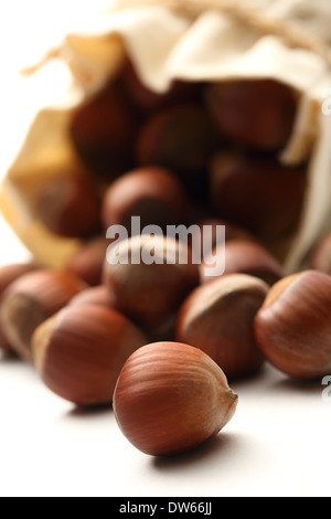fresh hazelnut in sack bag on white background Stock Photo - Alamy