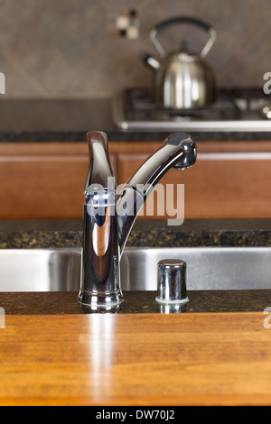 Counter tops and sink in kitchen Stock Photo - Alamy
