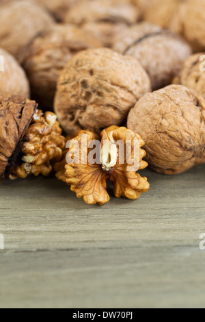 Walnuts background close up. Unshelled dried seeds of the common walnut ...