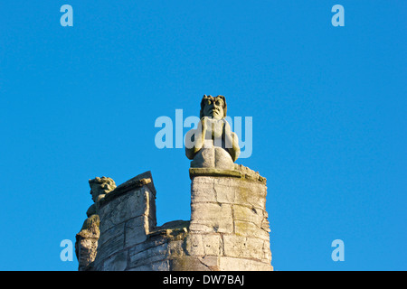Stone figure known as "boulder thrower" on top of 14th-century medieval ...