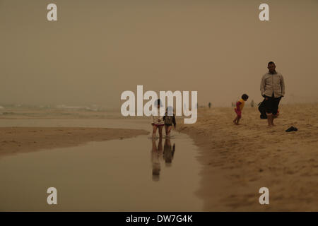 Palestinians enjoy the beach of the Mediterranean Sea during a heat ...
