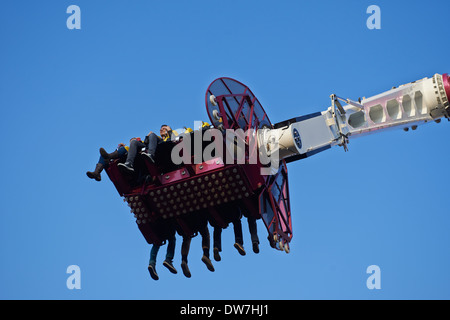 Claw which is a ride that spins people upside down. a carnival ride on ...