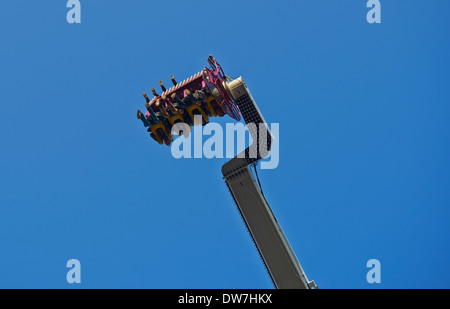 Claw which is a ride that spins people upside down. a carnival ride on ...
