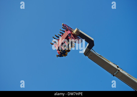 Claw which is a ride that spins people upside down. a carnival ride on ...