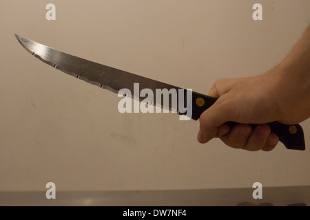 kitchen Knife teenager hand long sharp blade Stock Photo - Alamy