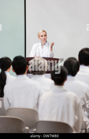 Female doctor giving a speech Stock Photo - Alamy
