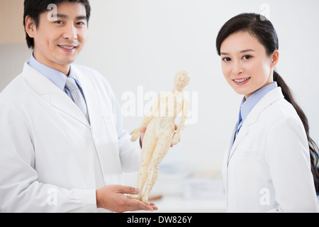 Asian women doctor holding anatomical organ model explaining medical ...