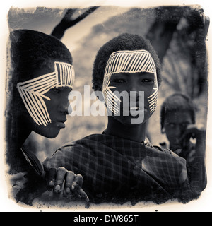 Maasai adolescents with painted face after the 'emorata' ceremony ...