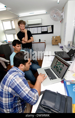 Afghan students learning to use a laptop computer Stock Photo - Alamy