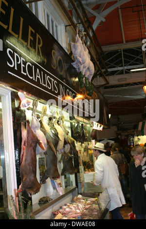 A butchers stall at Oxford covered market, specialising in game ...