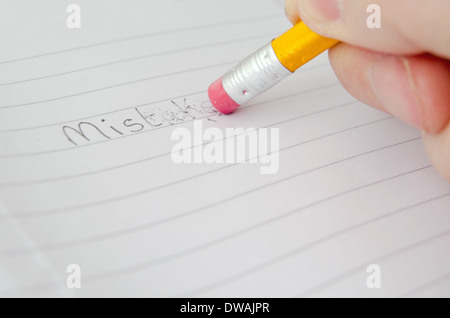 Pencil Eraser rubbing out a mistake Stock Photo - Alamy