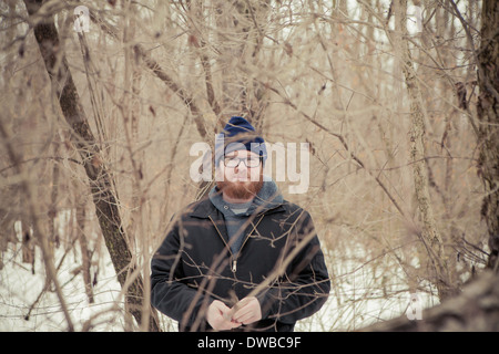 young man hiding in trees Stock Photo: 25413318 - Alamy