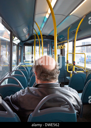 Bald man in arriva bus Cheshire UK Stock Photo - Alamy