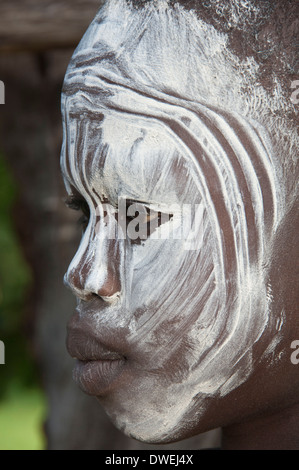 Portrait of a Surma girl, her face is painted in white ash color Stock ...