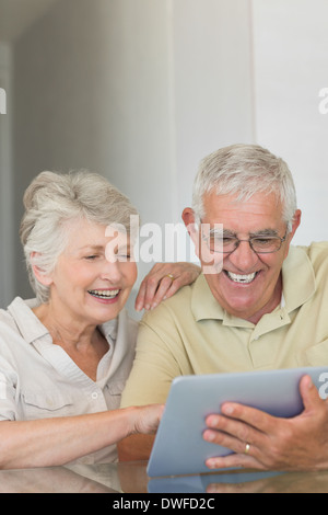 happy senior woman with tablet pc at home Stock Photo - Alamy