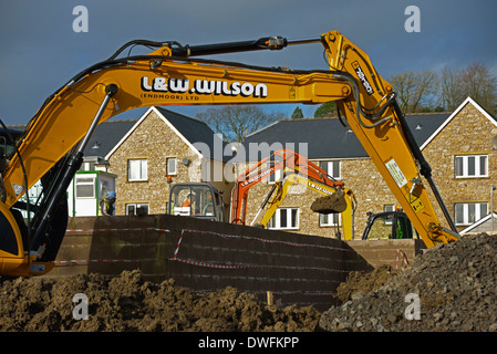 Excavators on house building site Stock Photo: 67342505 - Alamy