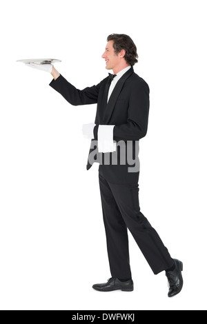 Server carrying tray over white background Stock Photo - Alamy