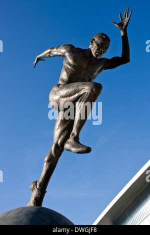 Athlete running in a stadium Stock Photo - Alamy