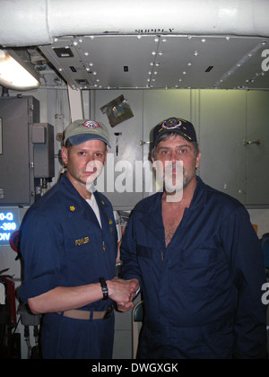 Maersk-Alabama Capt. Richard Phillips, stands alongside Lt. Cmdr. David ...