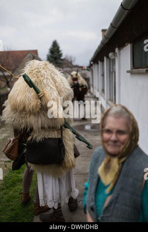 Mohacs, Hungary. 3rd Mar, 2014. Two young Buso boys are getting dressed ...