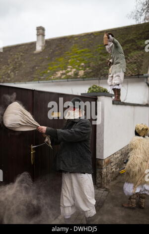Mohacs, Hungary. 3rd Mar, 2014. Two young Buso boys are getting dressed ...