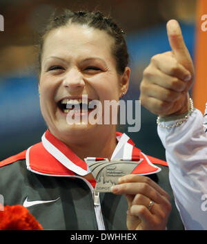German shot putter Christina Schwanitz presents her silver medal during ...